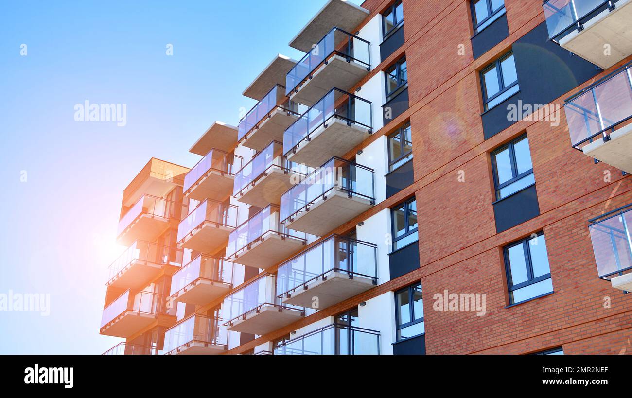 Futuristic square architecture of apartment building. Real estate with ...