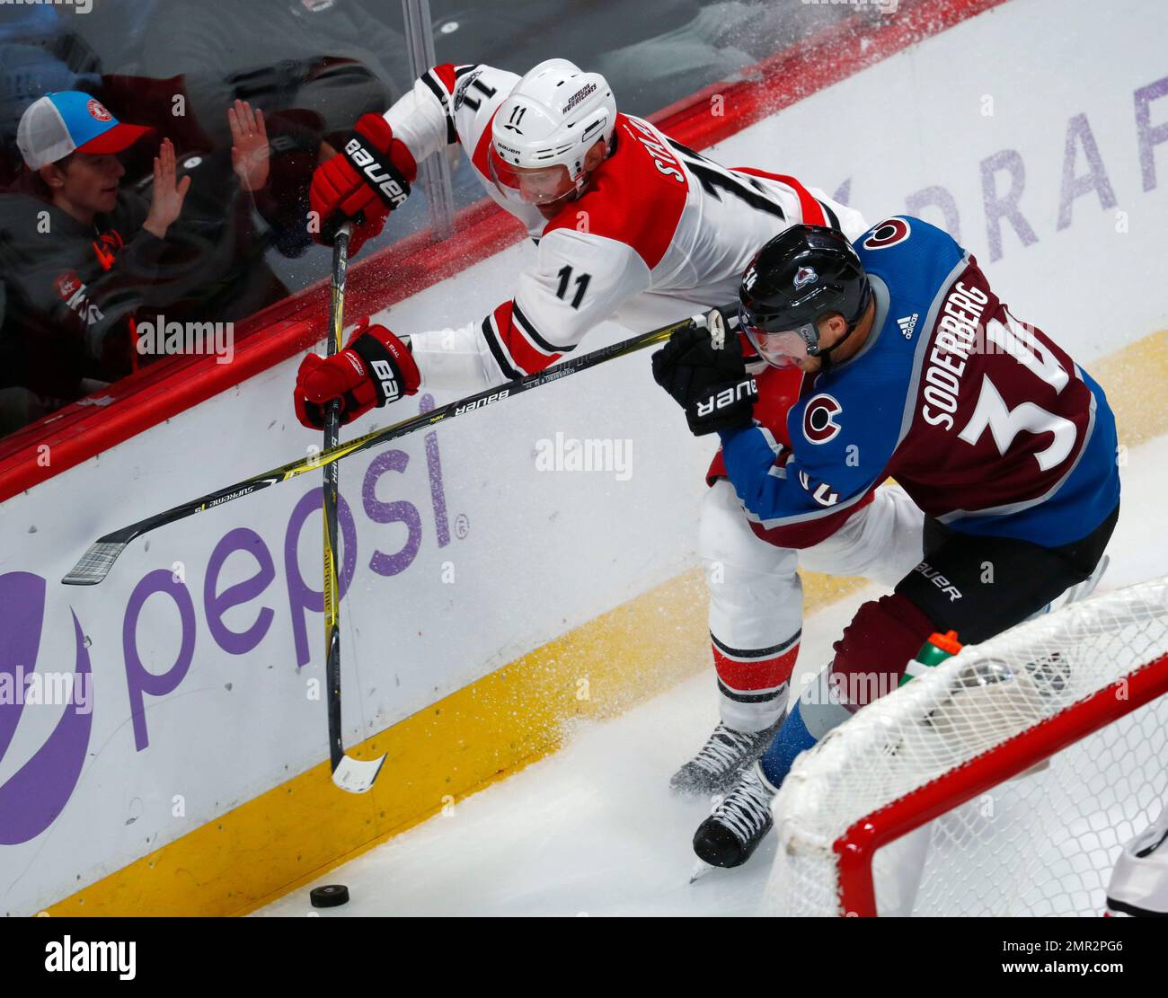 Colorado Avalanche center Carl Soderberg, right, of Sweden, checks ...