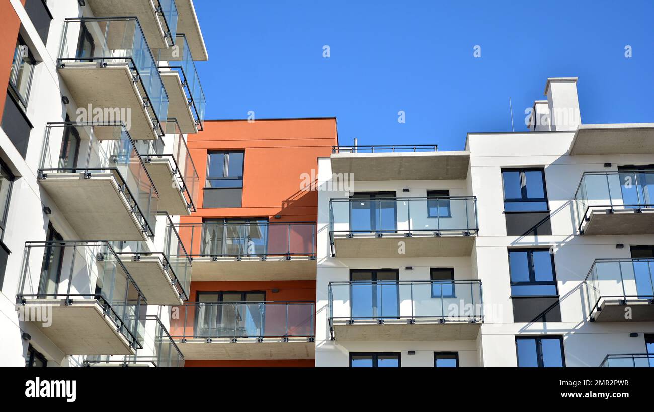 Futuristic square architecture of apartment building. Real estate with ...