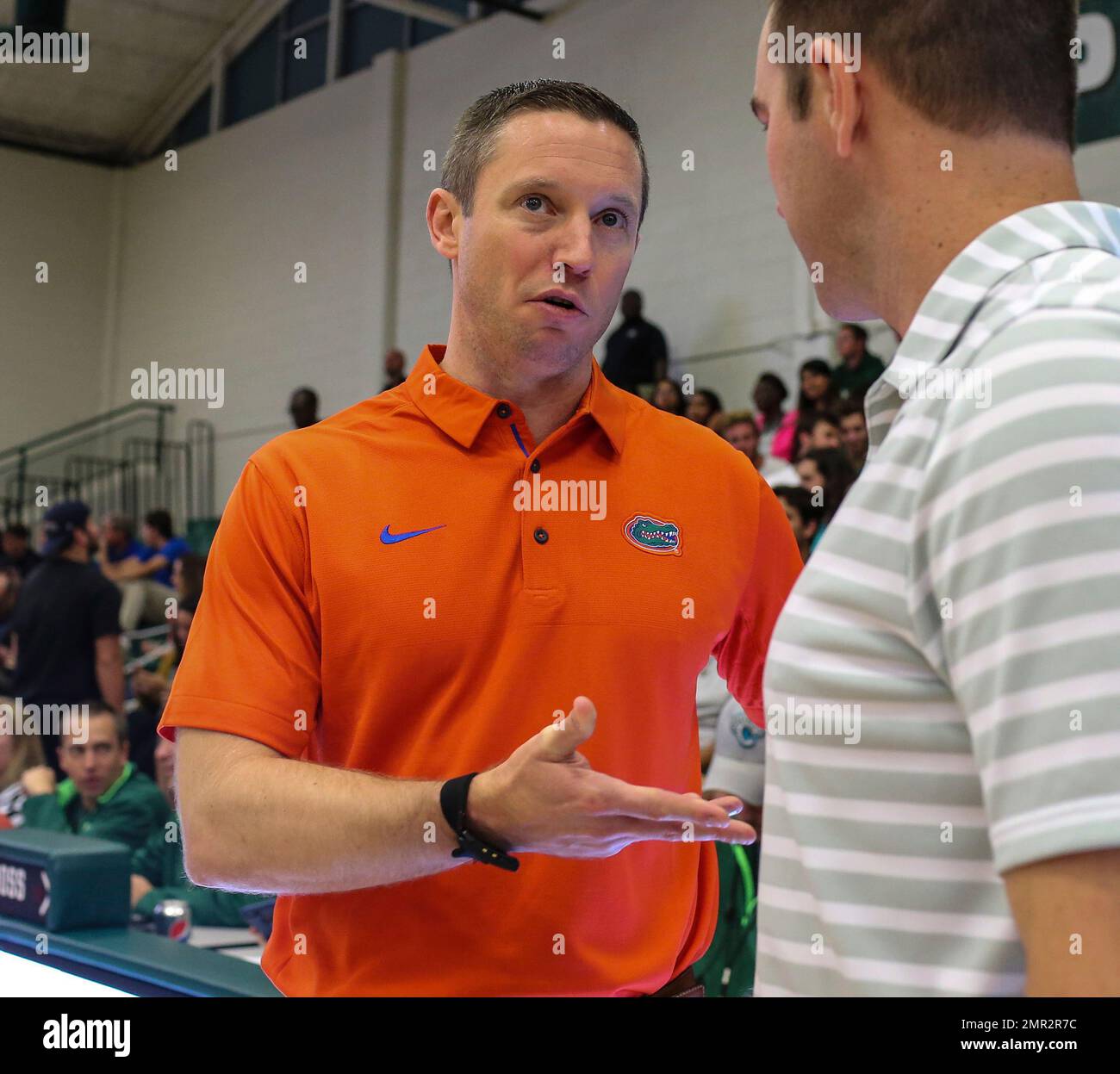 Florida head coach Mike White, left, speaks with Jacksonville head ...