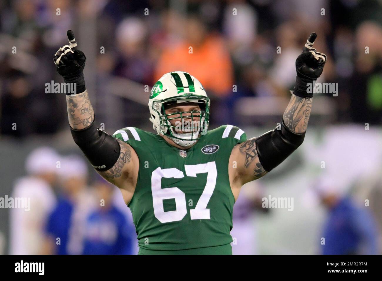 New York Jets offensive guard Brian Winters (67) gestures during the ...