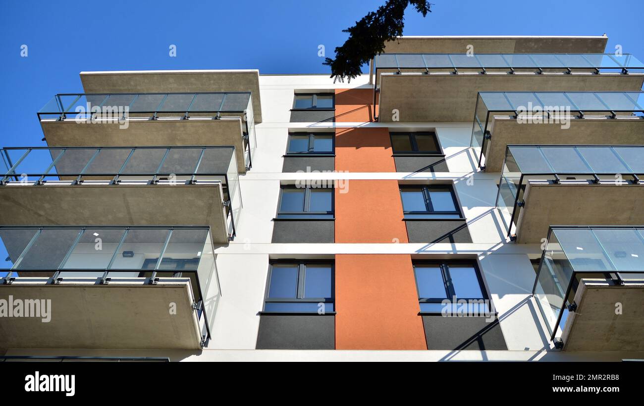 Futuristic square architecture of apartment building. Real estate with ...