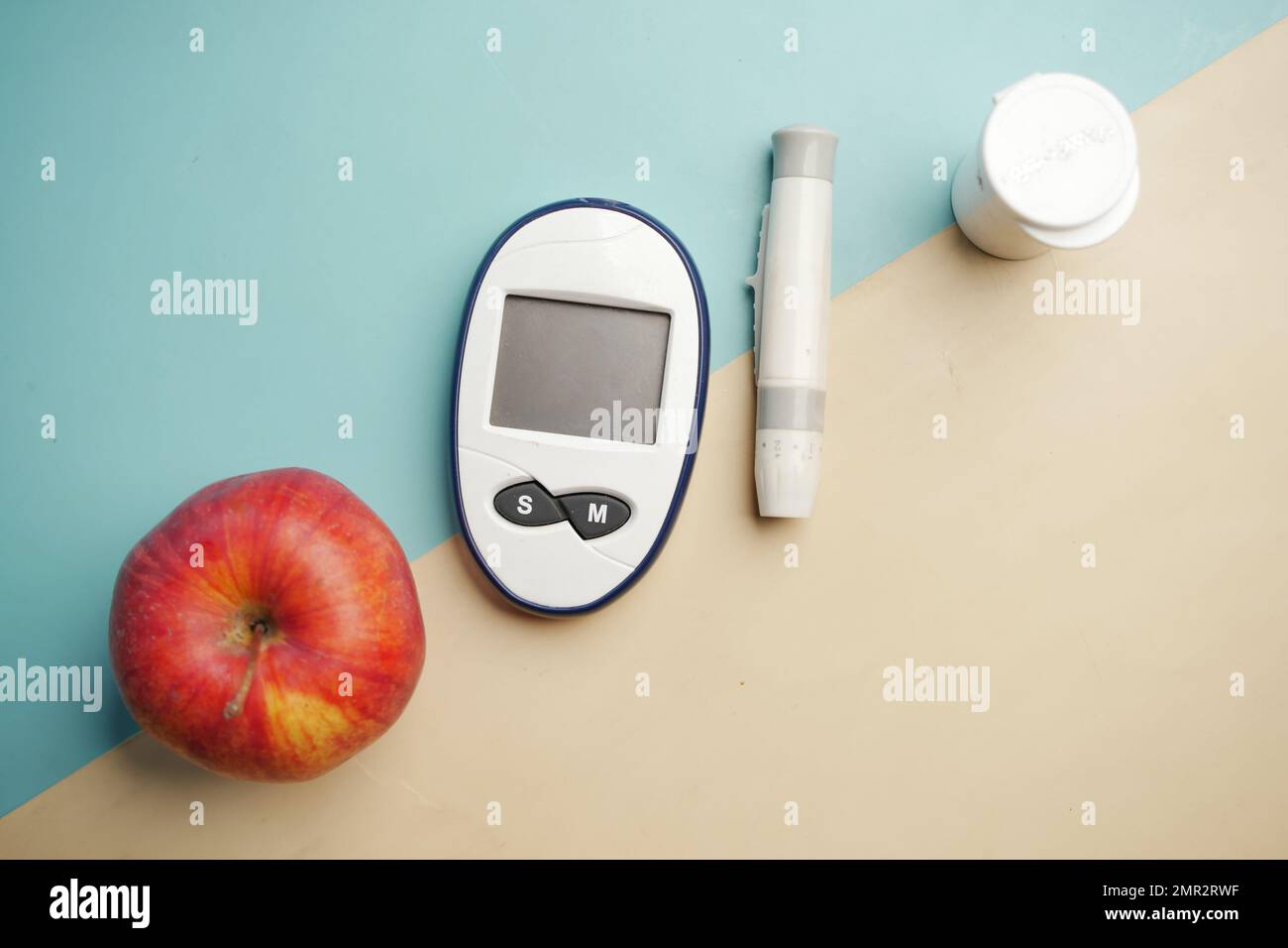 diabetic measurement tools, apple on table Stock Photo - Alamy
