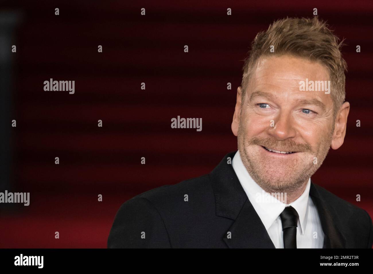 Director Kenneth Branagh poses for photographers upon arrival at the ...