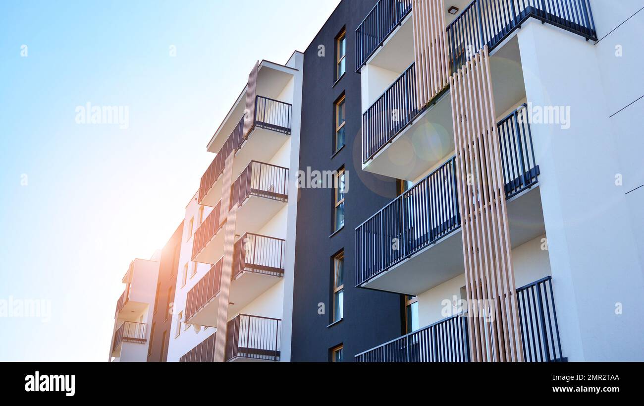 Futuristic square architecture of apartment building. Real estate with ...