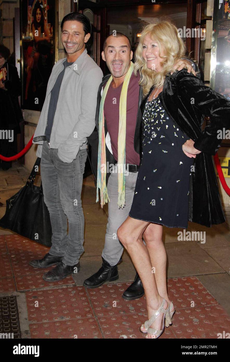 Choreographer and reality TV dance instructor Louie Spence (C) and ...