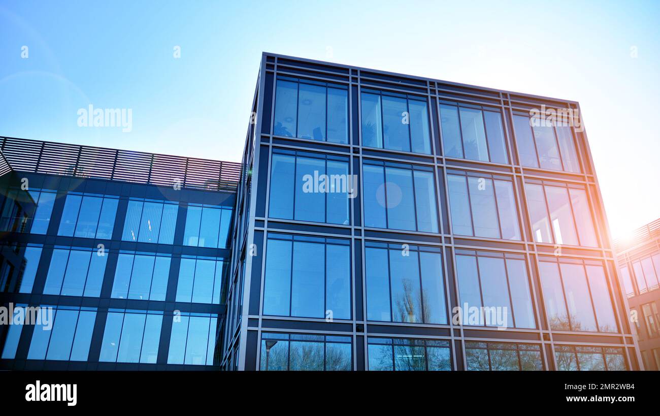 Abstract closeup of the glass-clad facade of a modern building covered ...