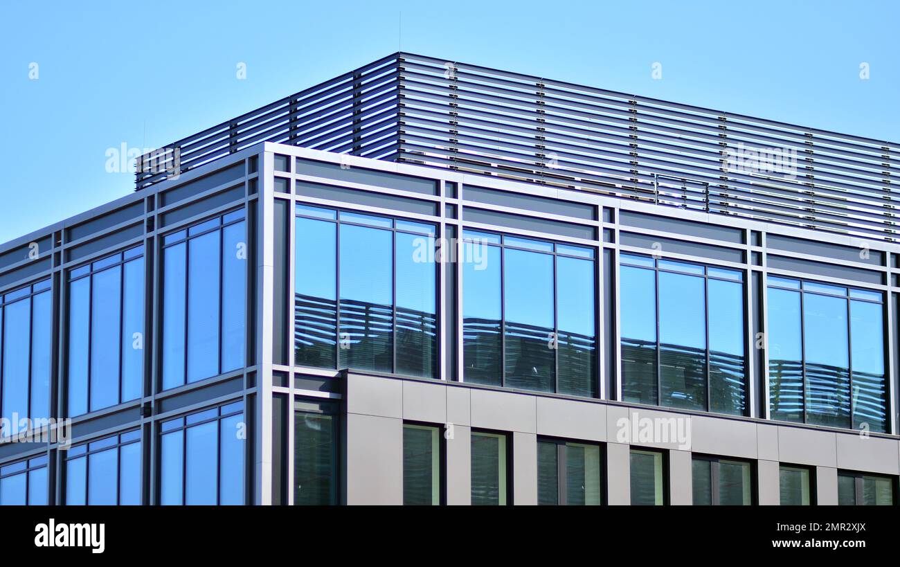 Abstract closeup of the glass-clad facade of a modern building covered ...