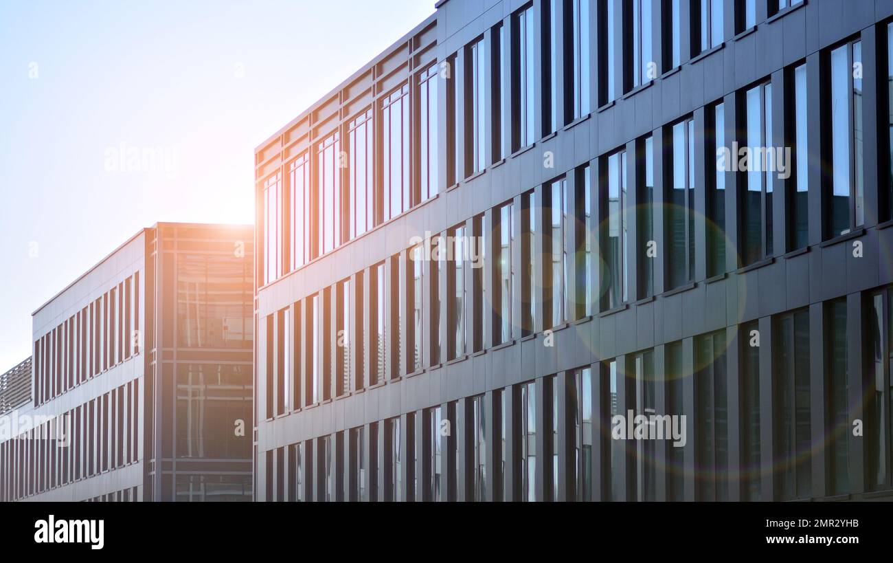 Abstract closeup of the glass-clad facade of a modern building covered ...