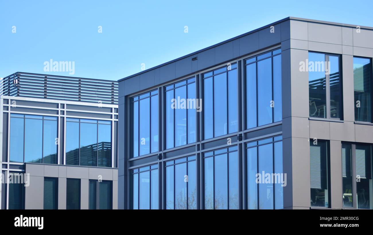 Abstract closeup of the glass-clad facade of a modern building covered ...