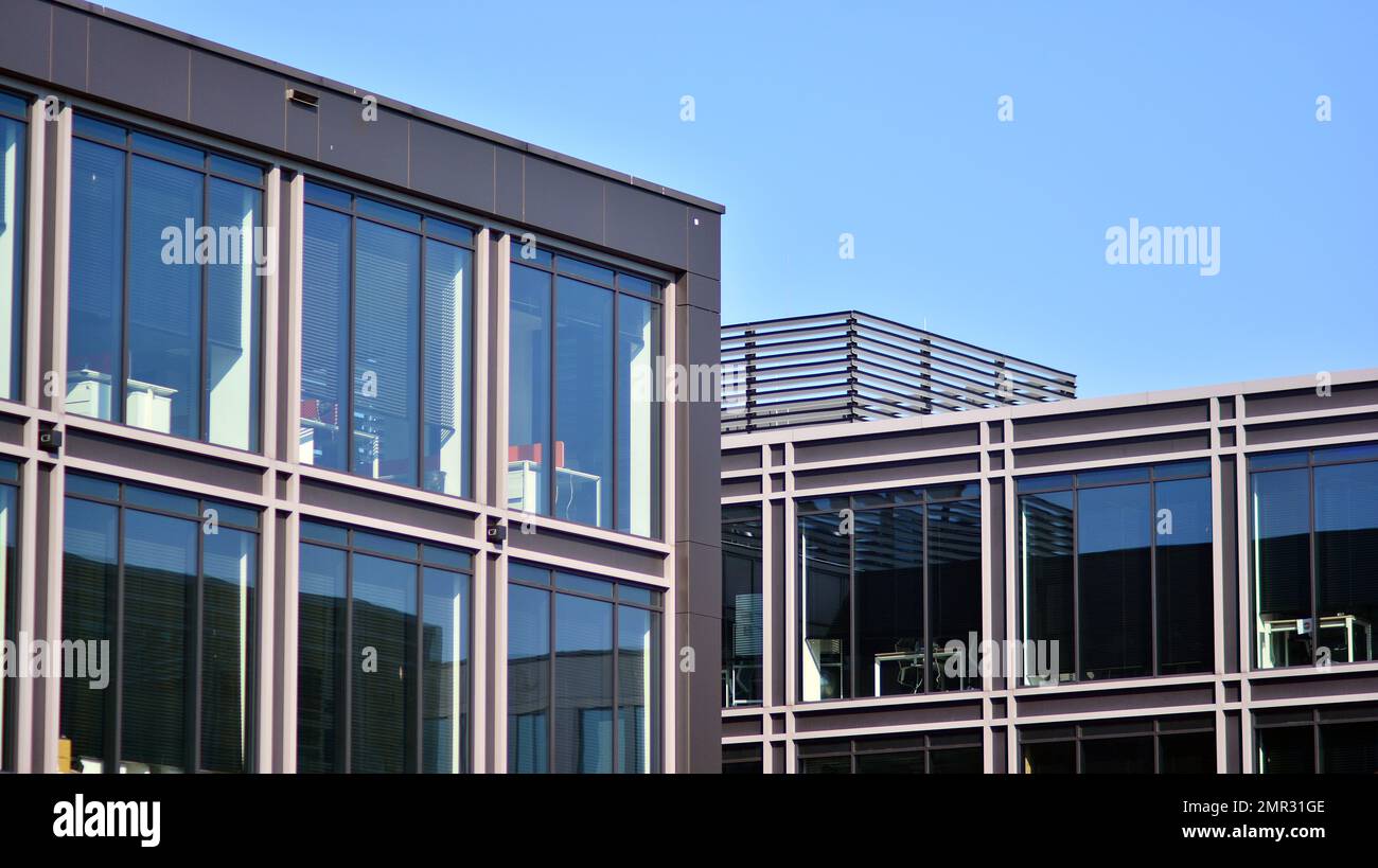 Abstract closeup of the glass-clad facade of a modern building covered ...