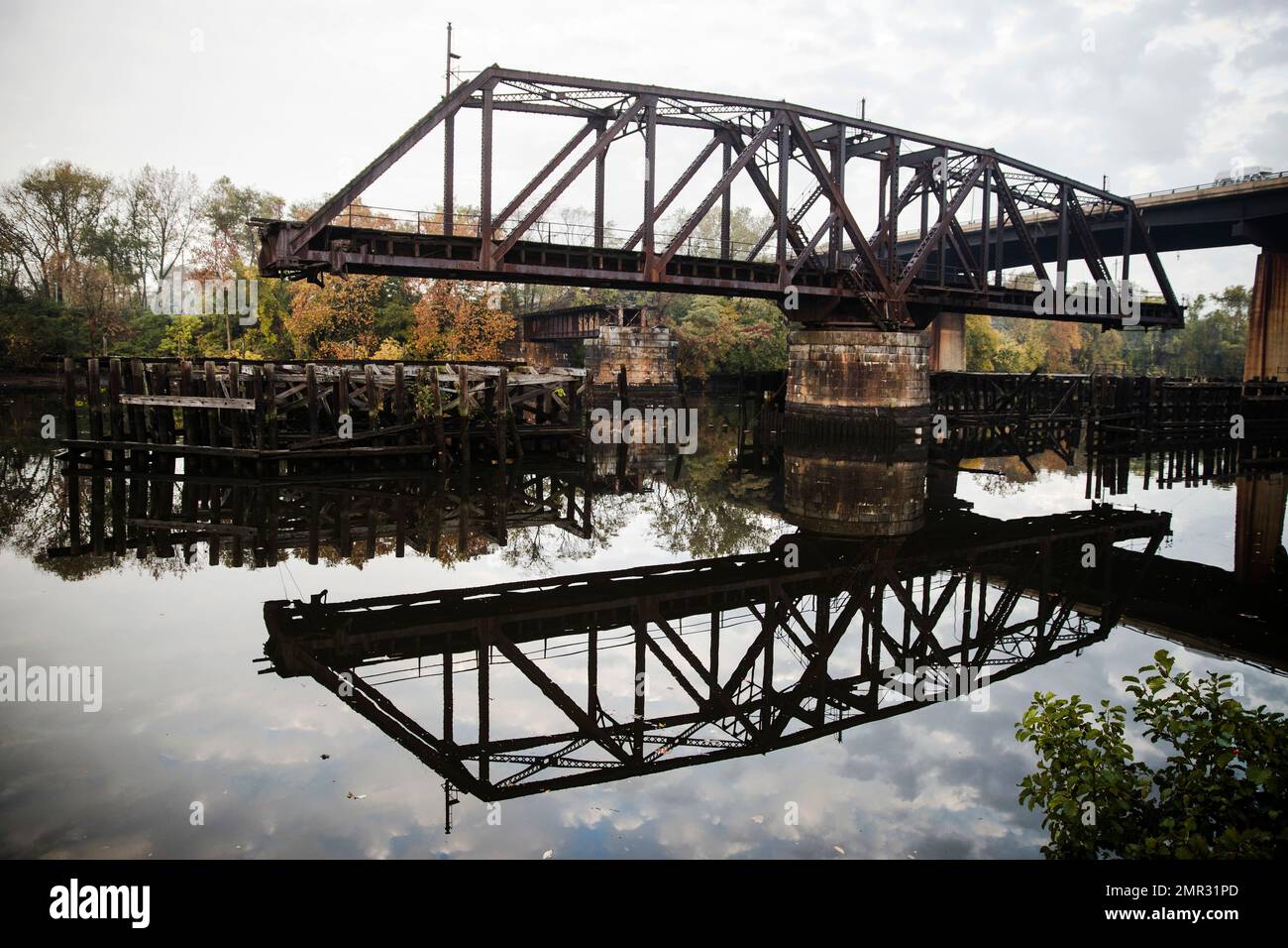 A swing bridge is reflected in the Schuylkill River in Philadelphia ...