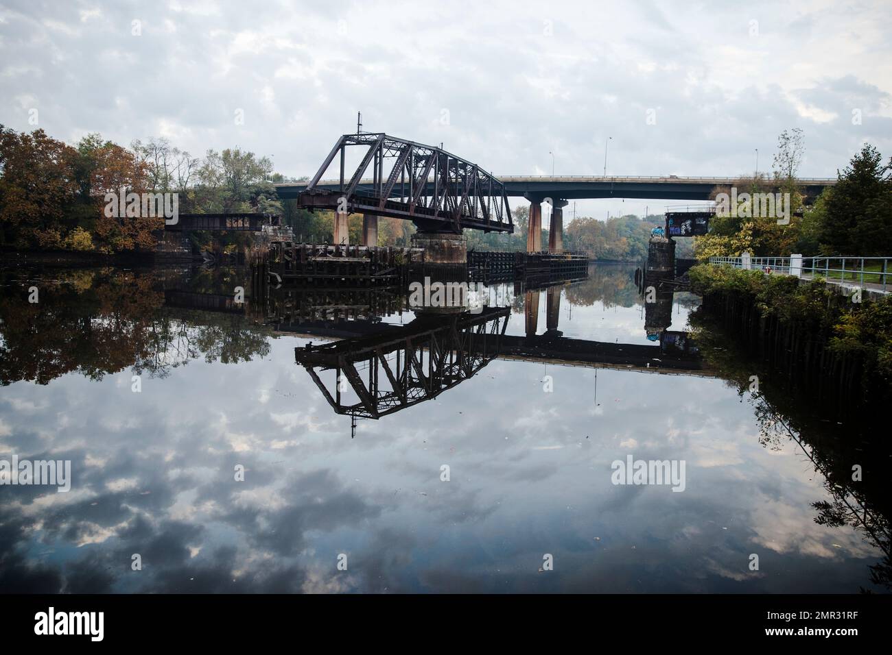 A swing bridge is reflected in the Schuylkill River in Philadelphia ...