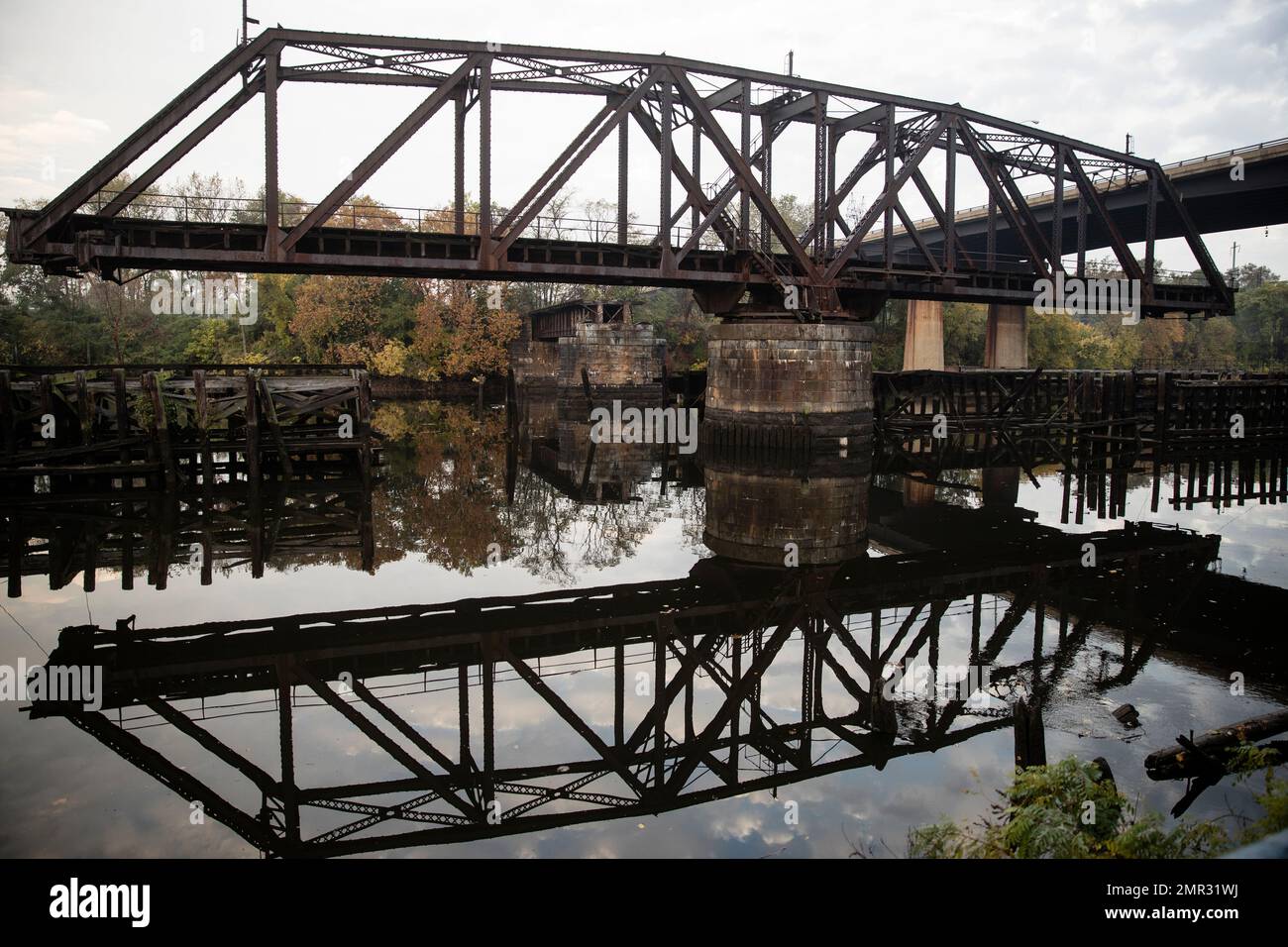 A swing bridge is reflected in the Schuylkill River in Philadelphia ...