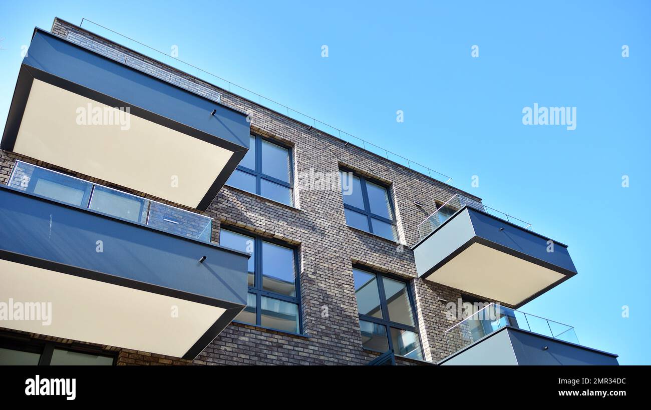 Futuristic square architecture of apartment building. Real estate with ...