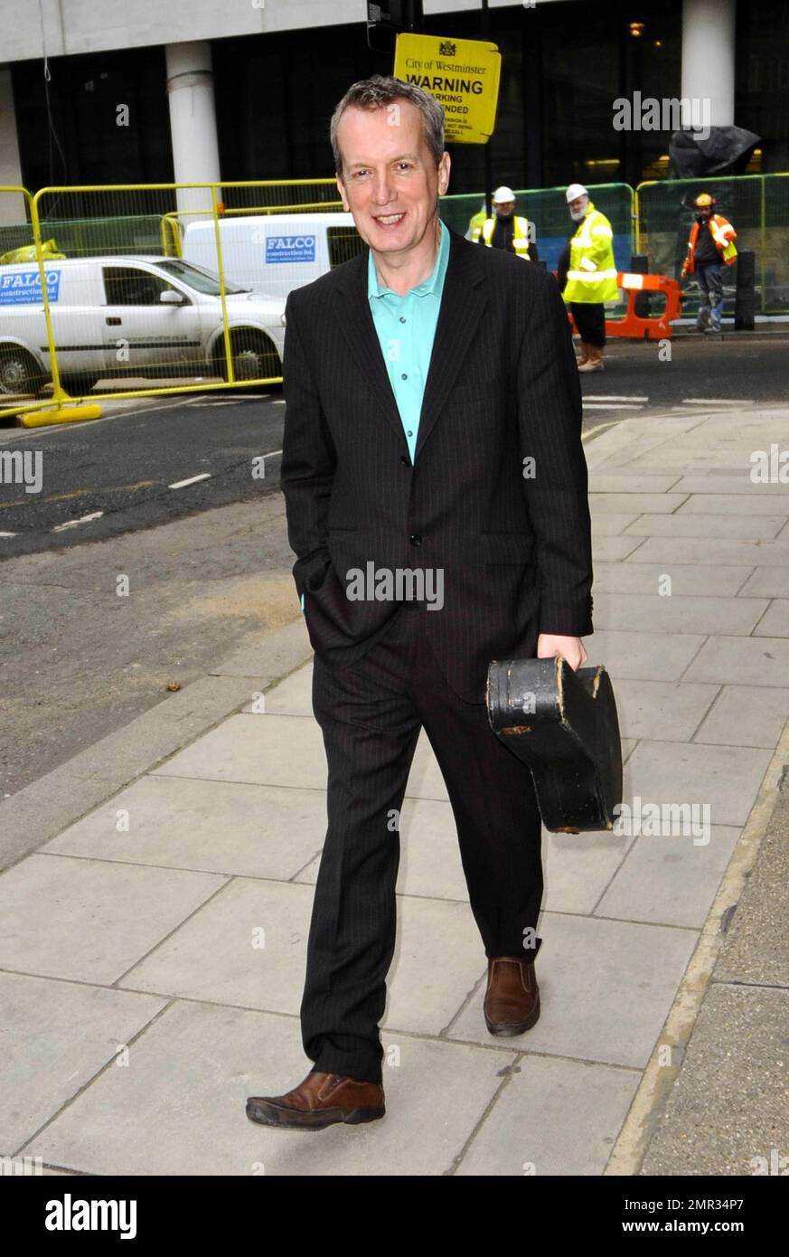 EXCLUSIVE!! UK writer, comedian and actor Frank Skinner carries his ...