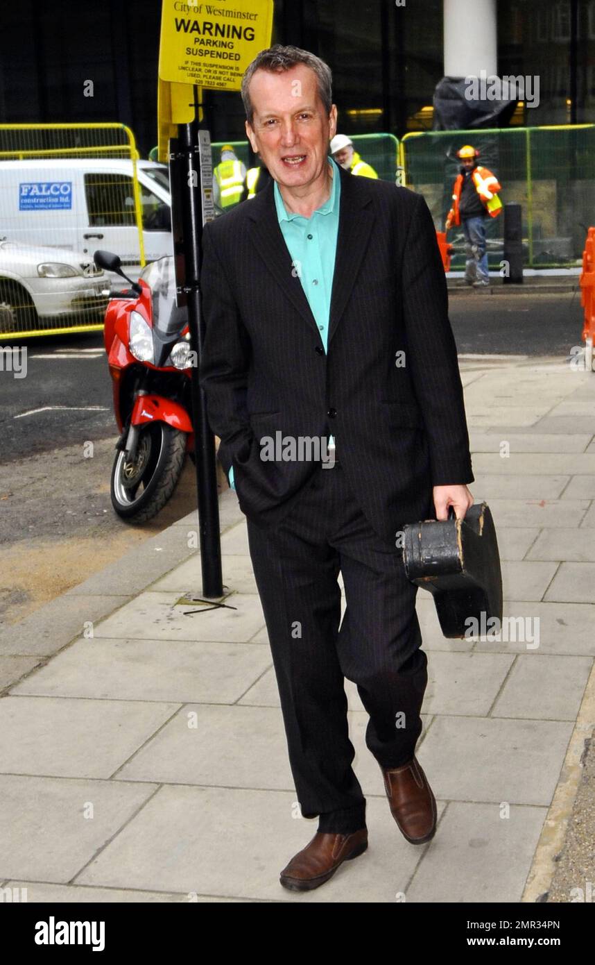 EXCLUSIVE!! UK writer, comedian and actor Frank Skinner carries his ...