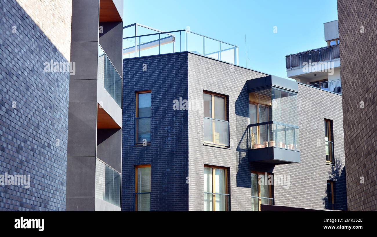 Futuristic square architecture of apartment building. Real estate with ...