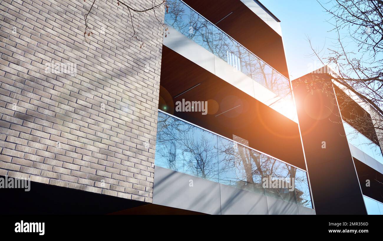 Futuristic square architecture of apartment building. Real estate with ...