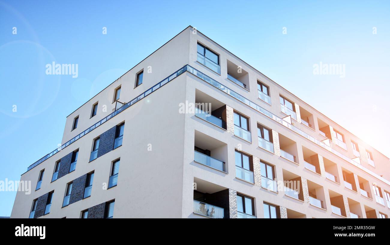 Futuristic square architecture of apartment building. Real estate with ...