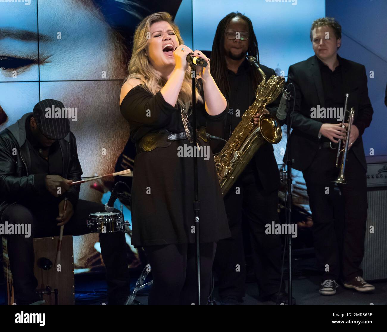 Singer Kelly Clarkson performs at a fan event celebrating the release ...
