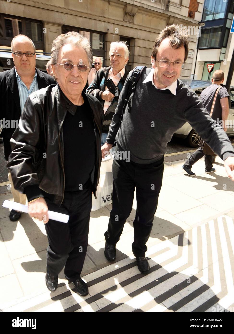 Frontman of The Four Seasons, Frankie Valli signs autographs and waves ...