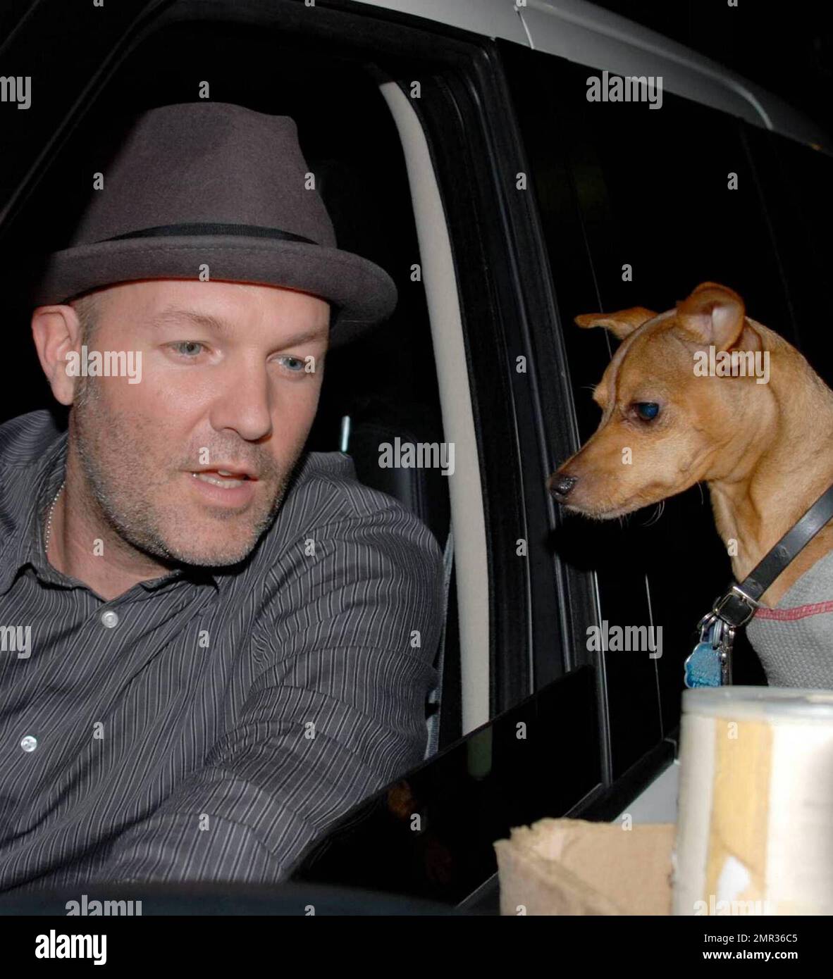 Limp Bizkit frontman Fred Durst looks deep in thought alongside a cute ...