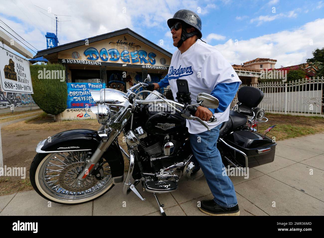 Landscape businessman Manny Vazquez from Pasadena, Calif., rides his ...