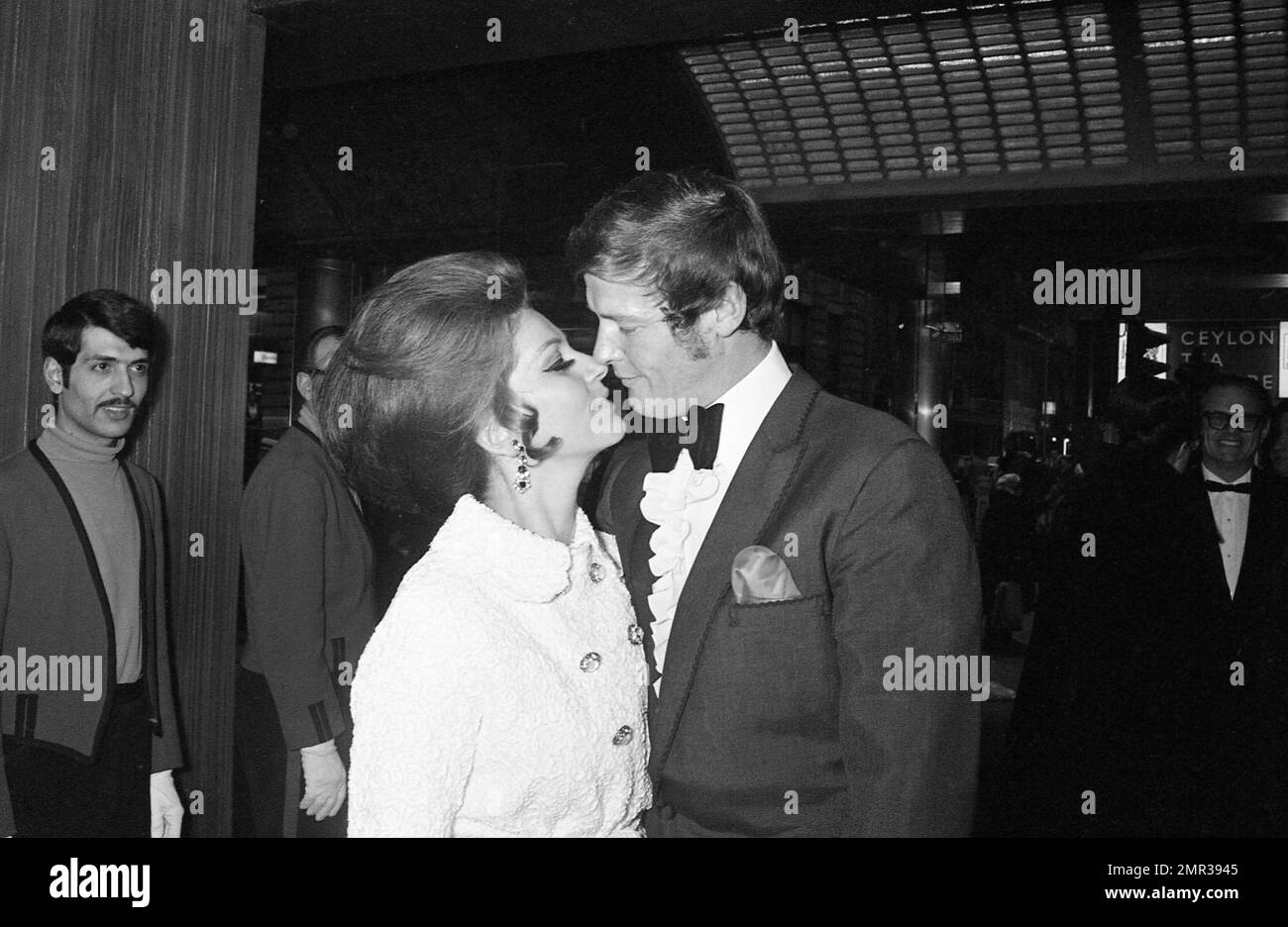 British actor Roger Moore and Italian actress Luisa Mattioli arrive at ...