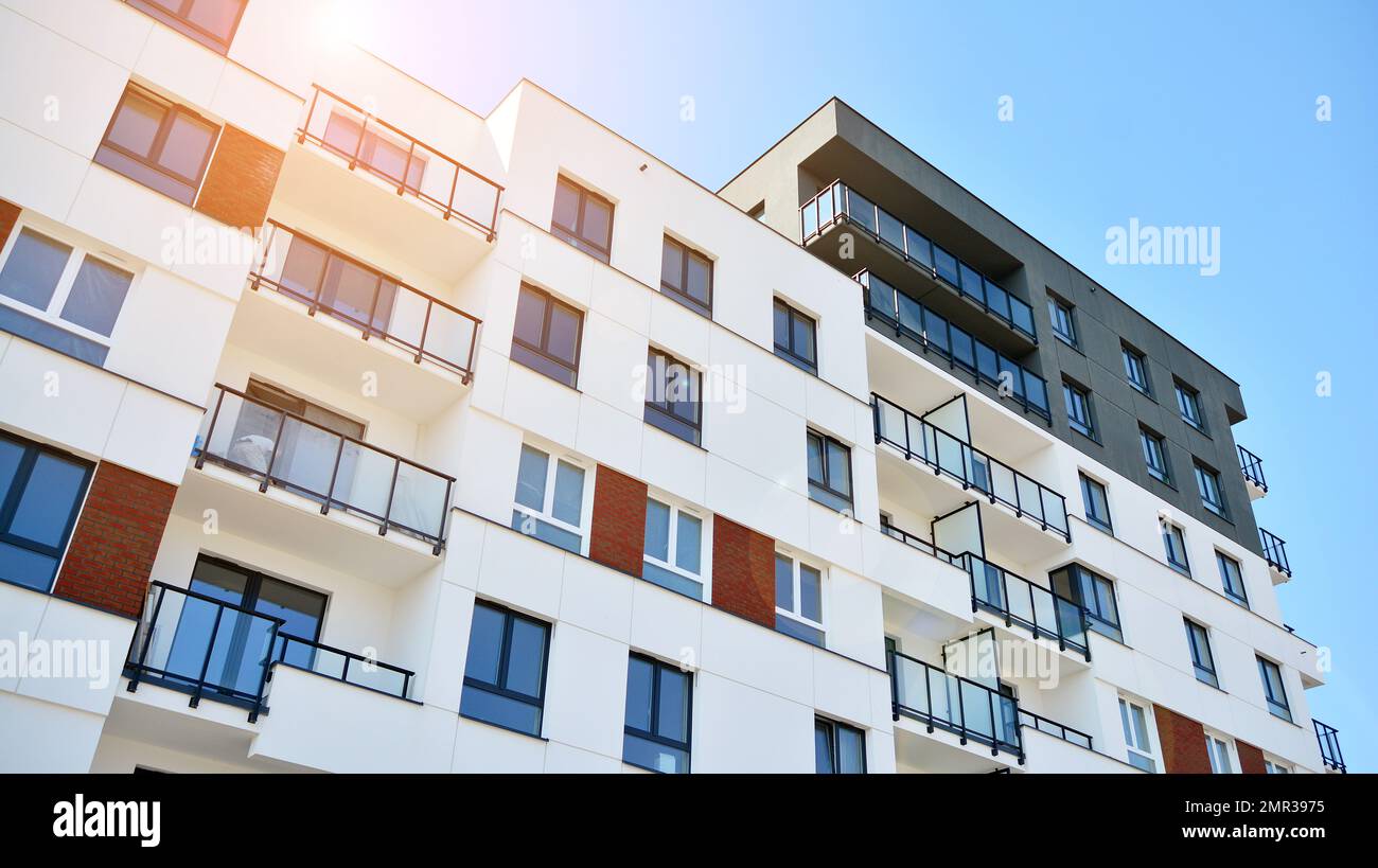 Futuristic square architecture of apartment building. Real estate with ...