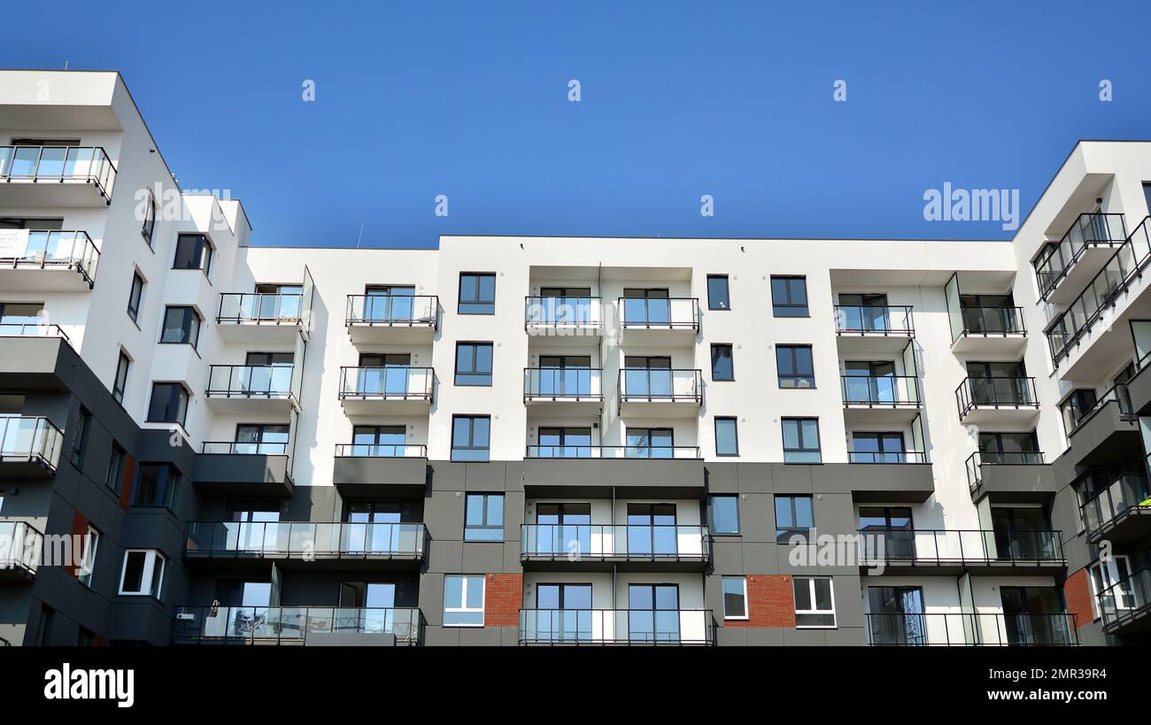 Futuristic square architecture of apartment building. Real estate with ...