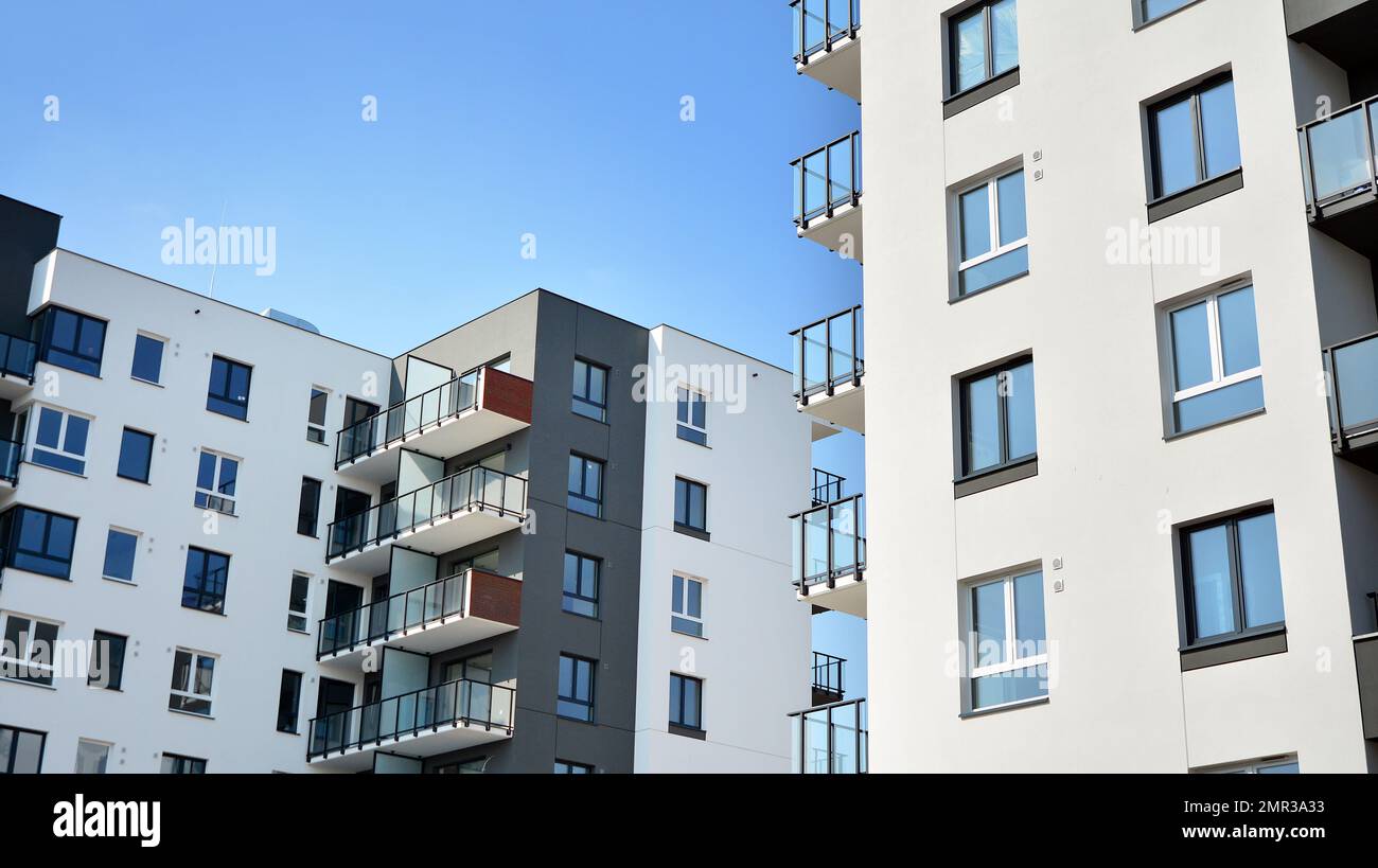 Futuristic square architecture of apartment building. Real estate with ...