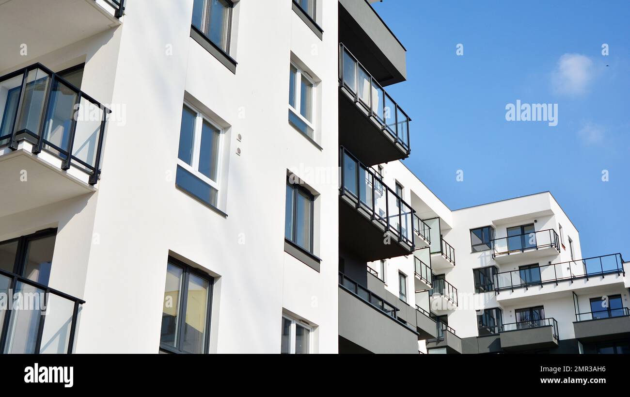 Futuristic square architecture of apartment building. Real estate with ...