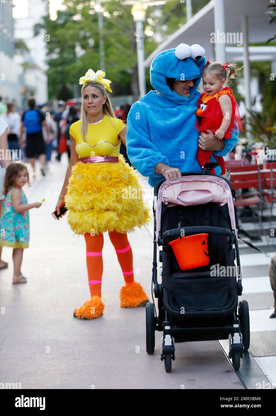 Josh Keller, center, walks with his daughter Isabel, 1, and his wife ...