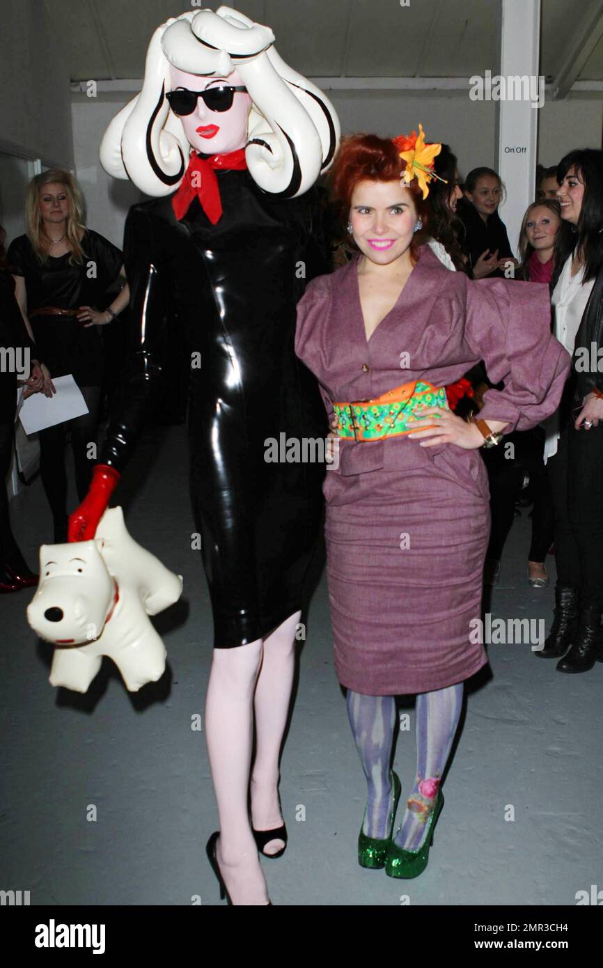 Paloma Faith poses with a guest dressed in a rubber suit at the Pam ...