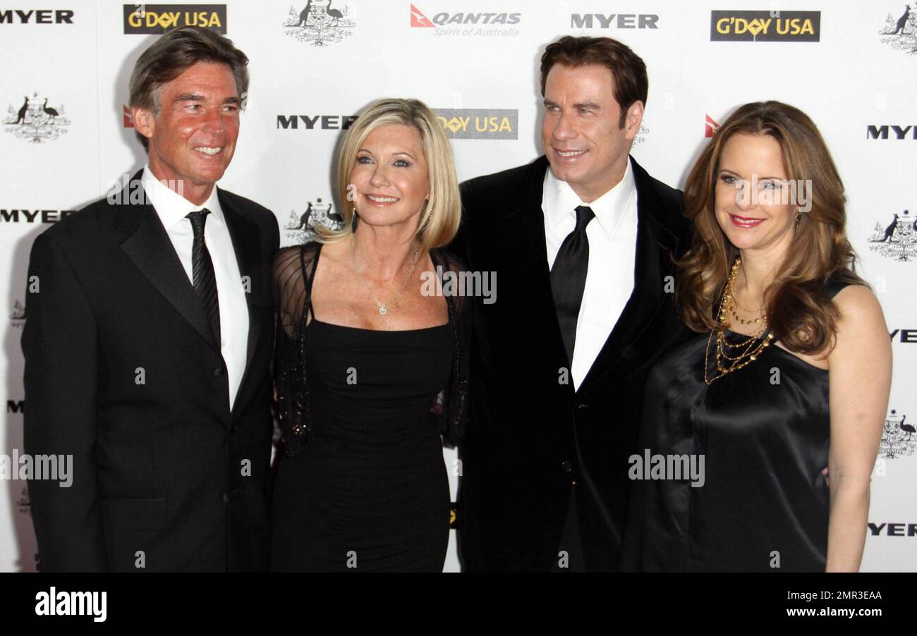 "Grease" co-stars Olivia Newton-John and John Travolta pose with their spouses John Easterling ...