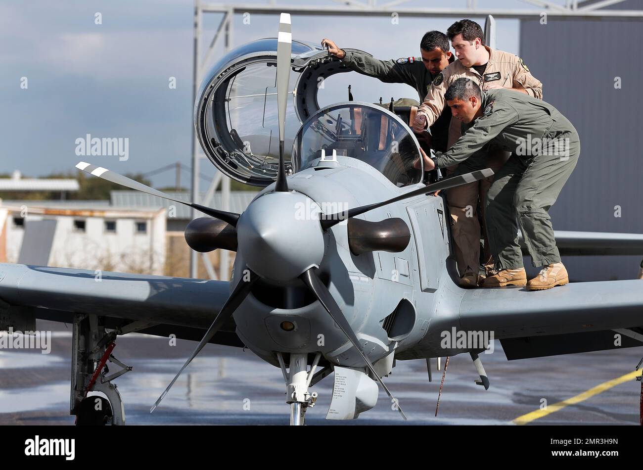 Lebanese Air Force pilots check the cockpit of a Super Tucano A29 ...