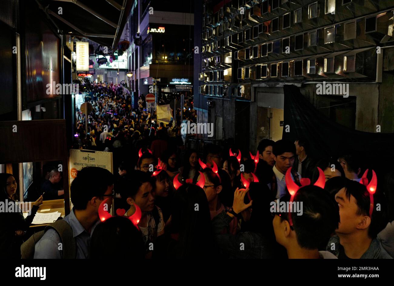Participants wear devil horns to celebrate Halloween in Lan Kwai Fong ...