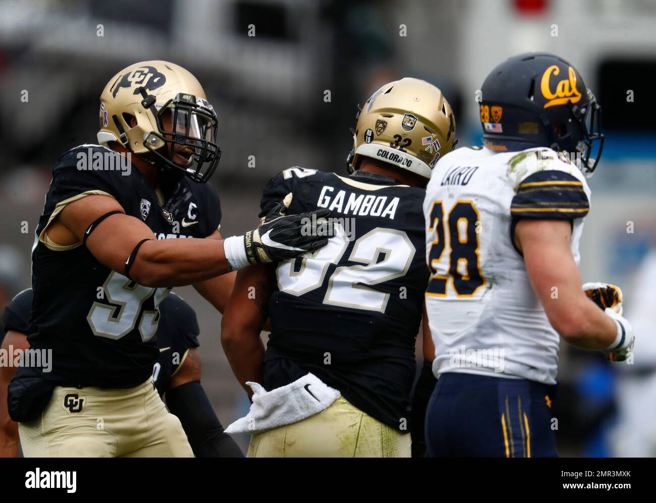 Colorado Buffaloes linebacker Derek McCartney (95), left, celebrates a ...