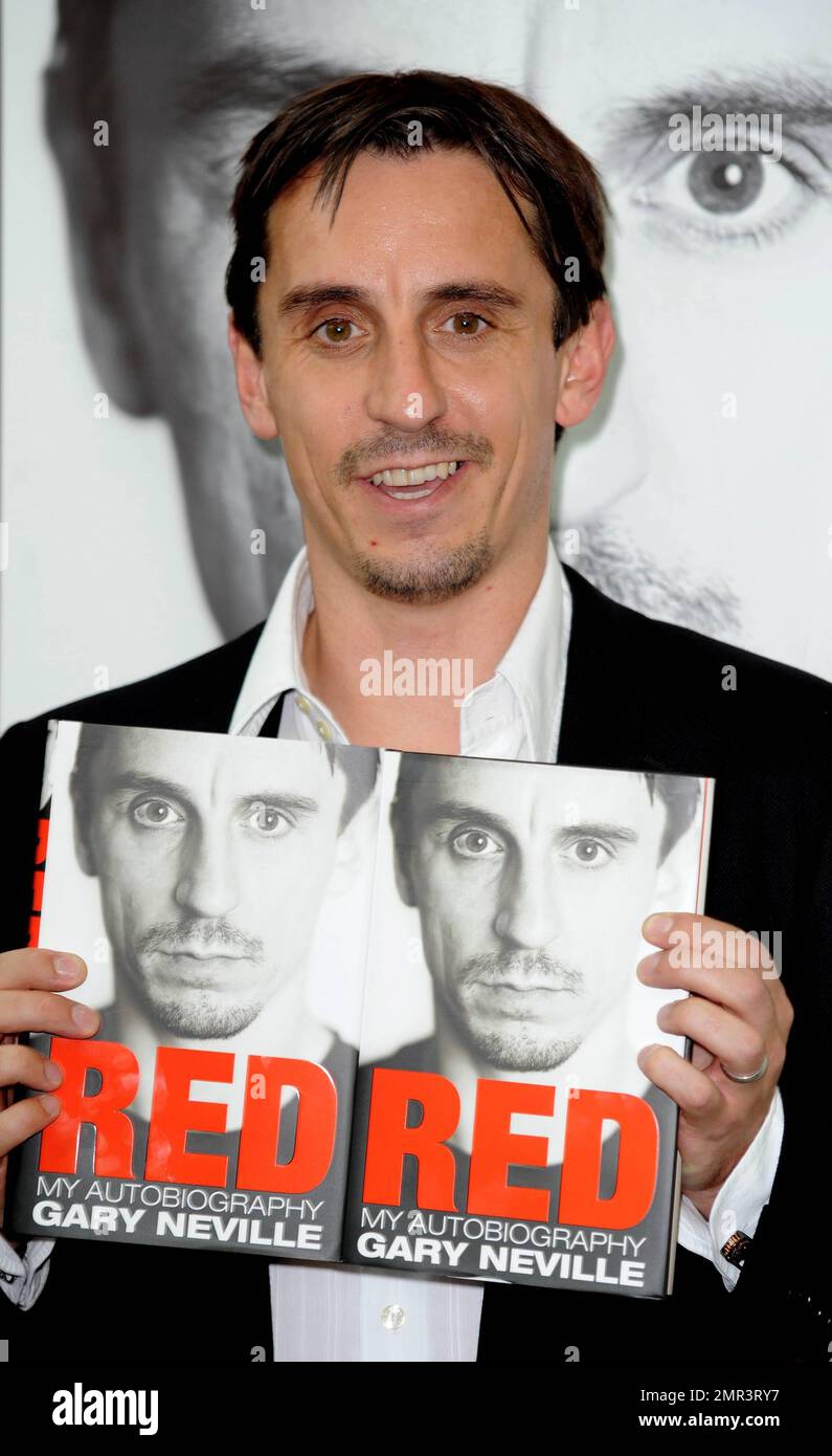 USA, CANADA, LATIN AMERICA AND GREECE ONLY - Gary Neville signs copies ...