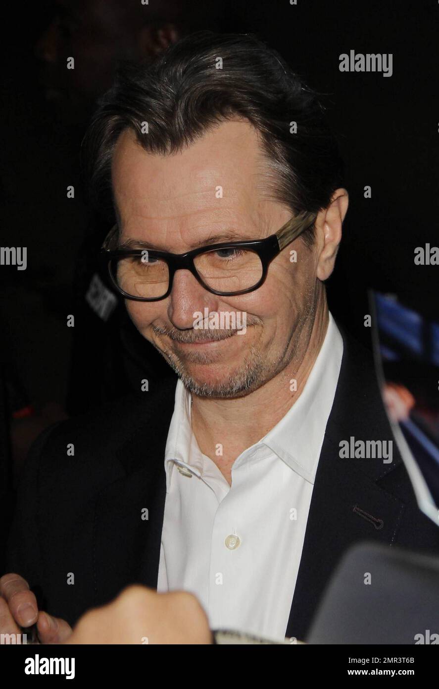 Recent Oscar nominee Gary Oldman signs autographs for fans outside the ...
