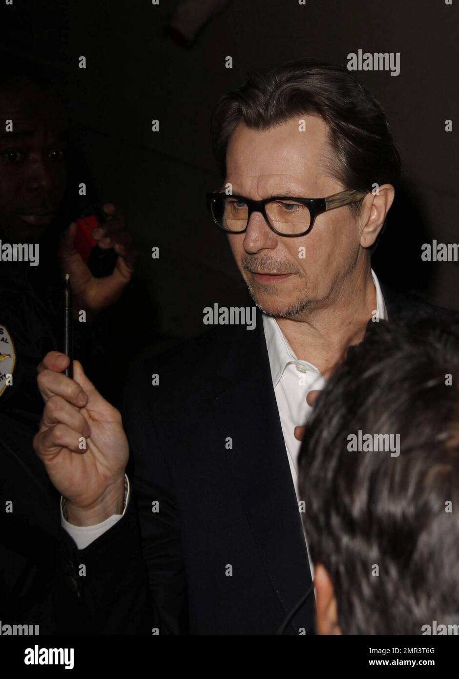 Recent Oscar nominee Gary Oldman signs autographs for fans outside the ...