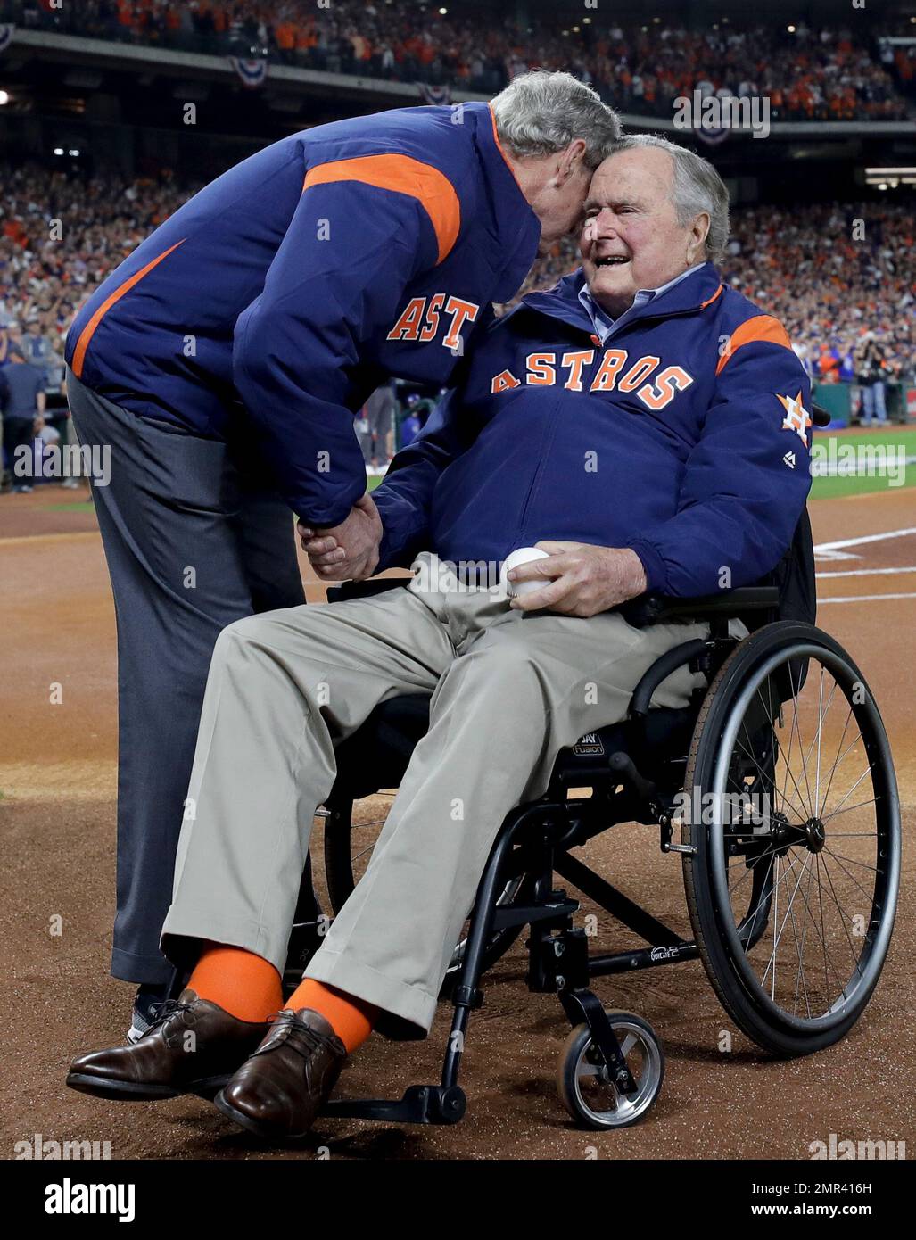 Former Presidents George H.W. Bush and George W. Bush hug before the ...