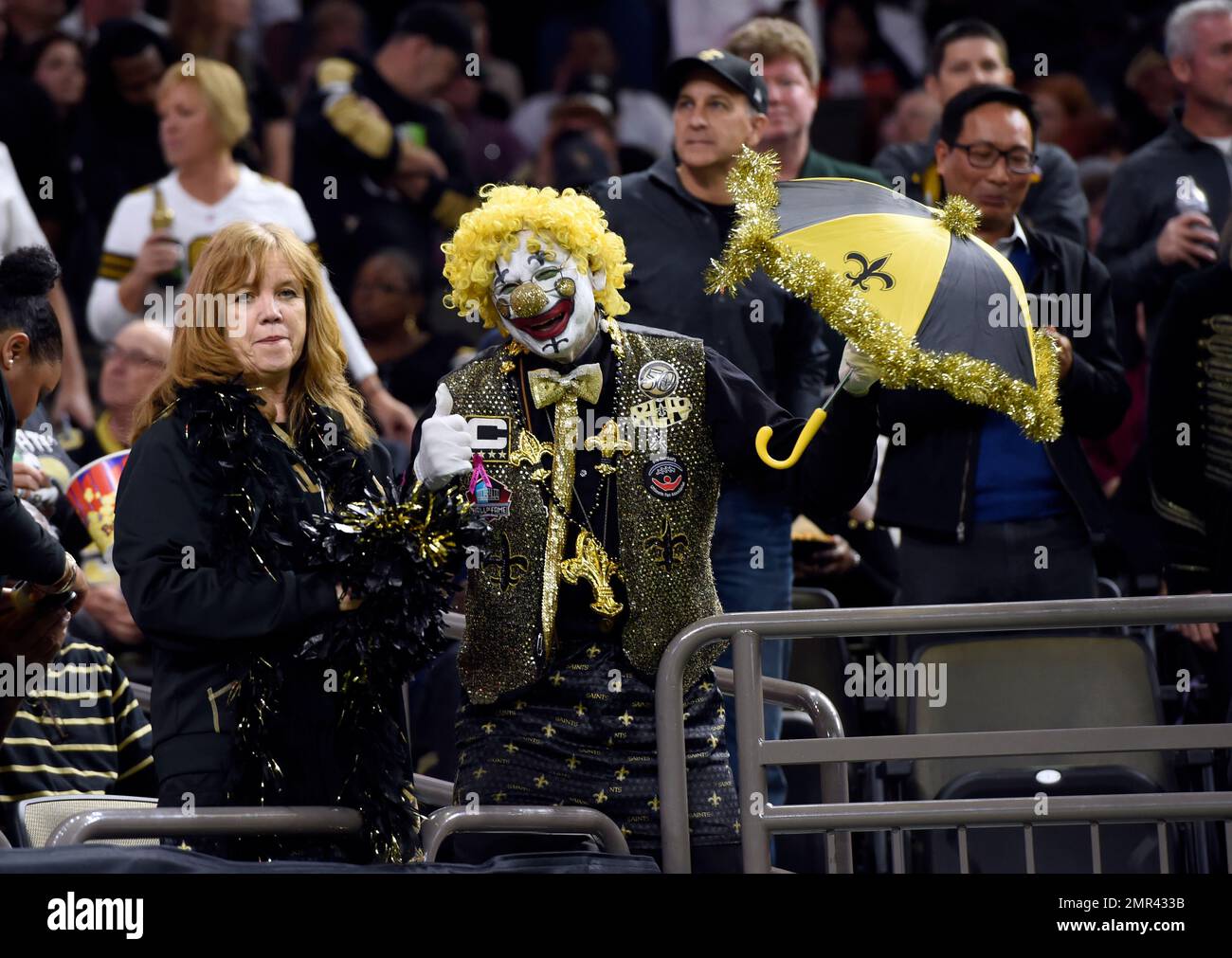 Fans wear Halloween costumes during an NFL football game between the ...