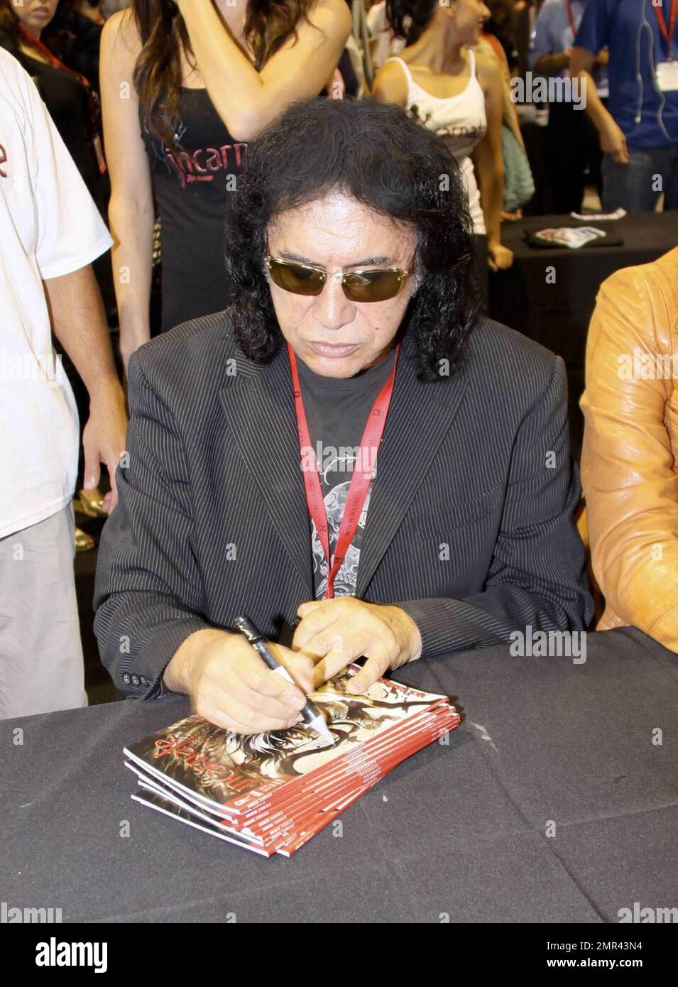Gene Simmons signs autographs during Comic-Con San Diego 2009. San ...