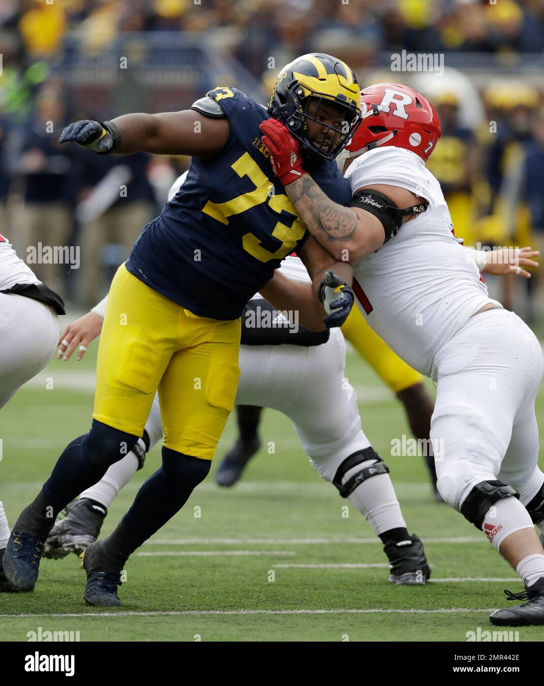Michigan defensive lineman Maurice Hurst (73) goes up against Rutgers ...