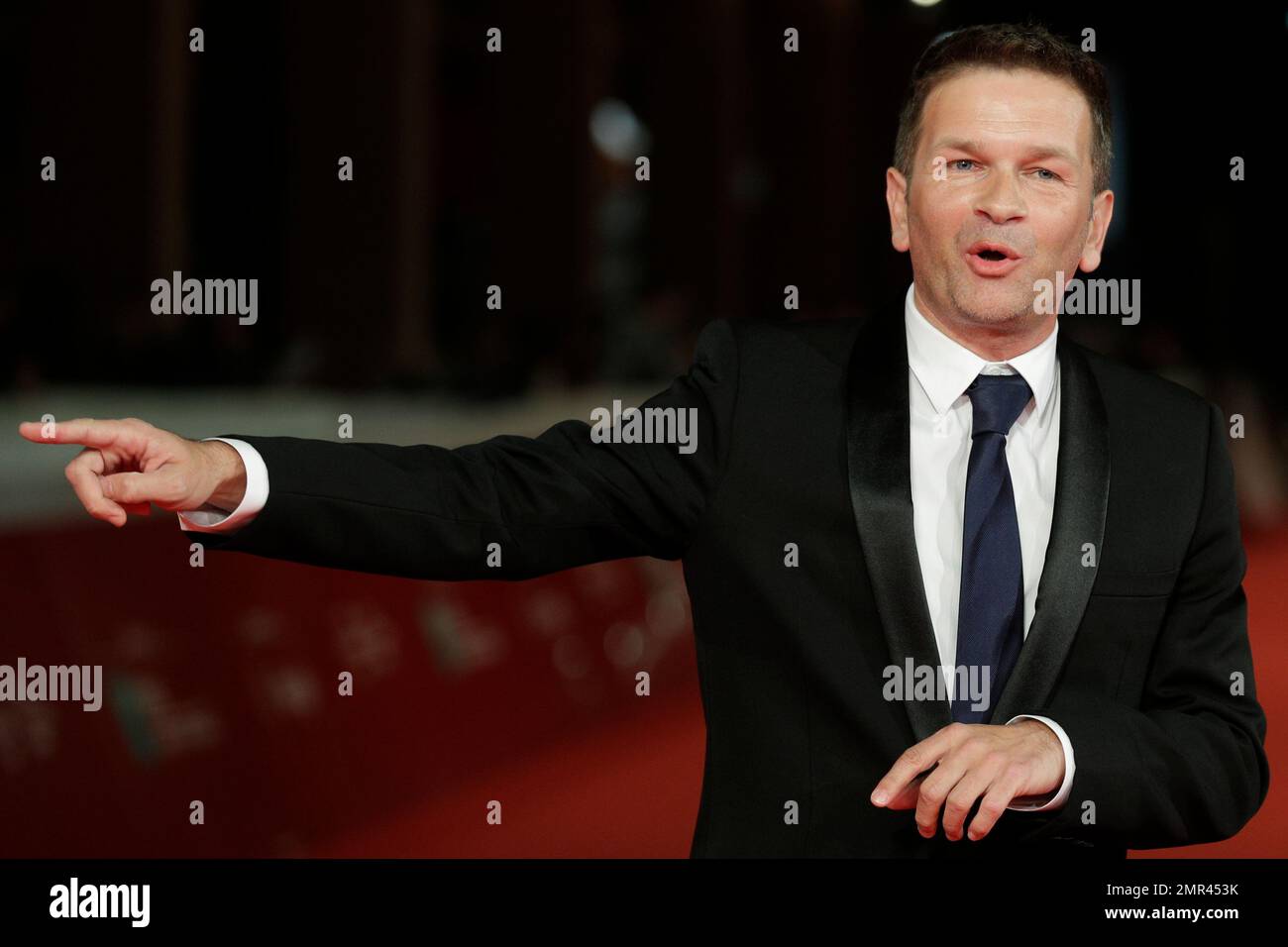 Director Gael Morel poses for photos on the red carpet on the occasion ...