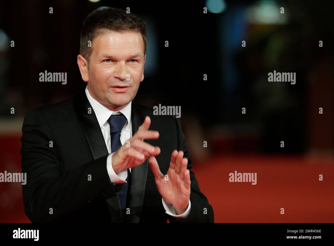 Director Gael Morel poses for photos on the red carpet on the occasion ...