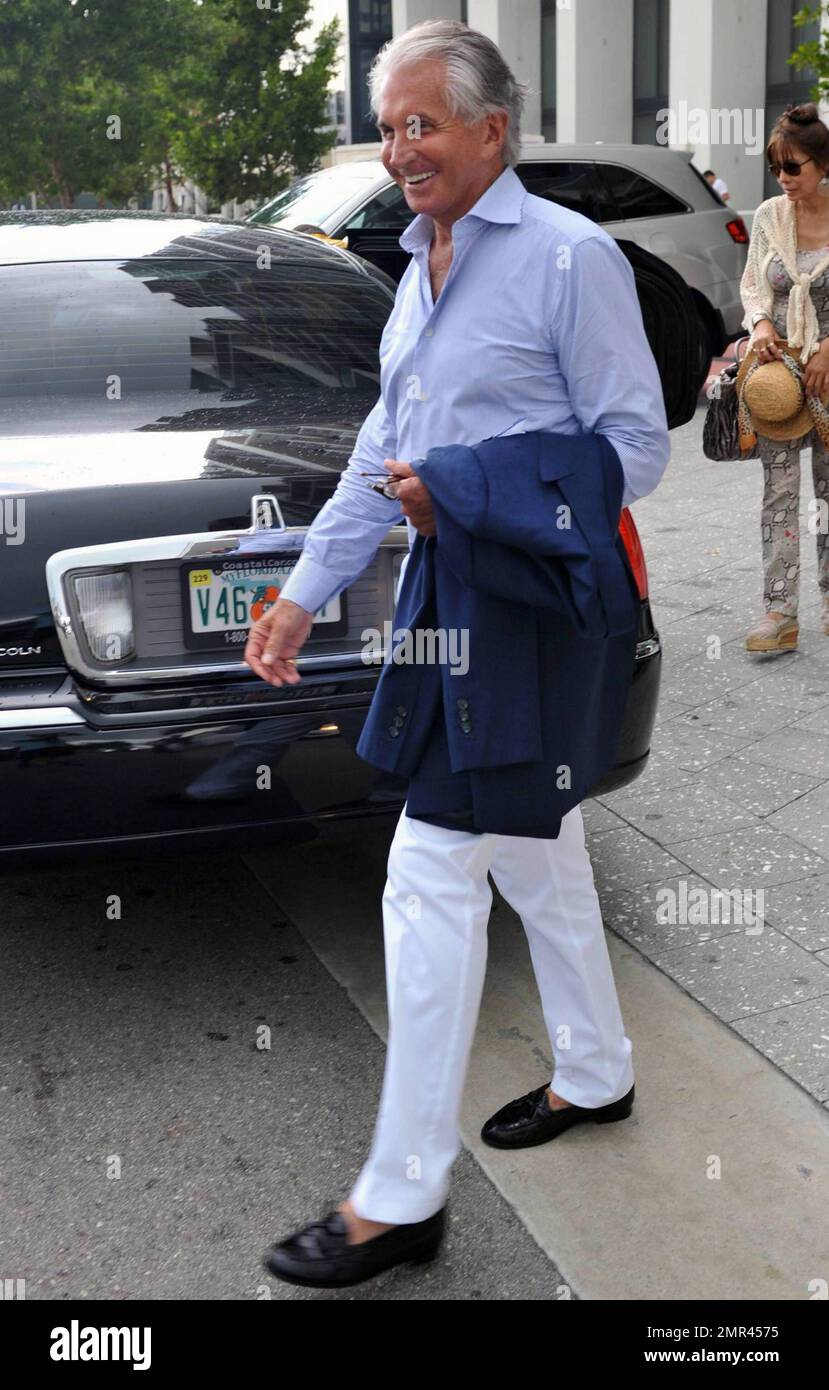 Actor George Hamilton is all smiles as he leaves his luxury hotel while ...
