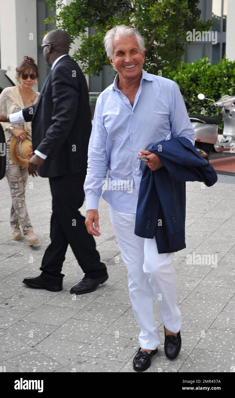 Actor George Hamilton is all smiles as he leaves his luxury hotel while ...